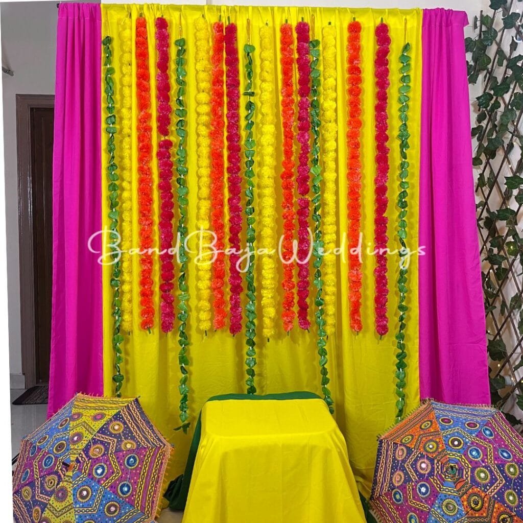 Marigold Haldi Backdrop Decoration - Band Baja Weddings