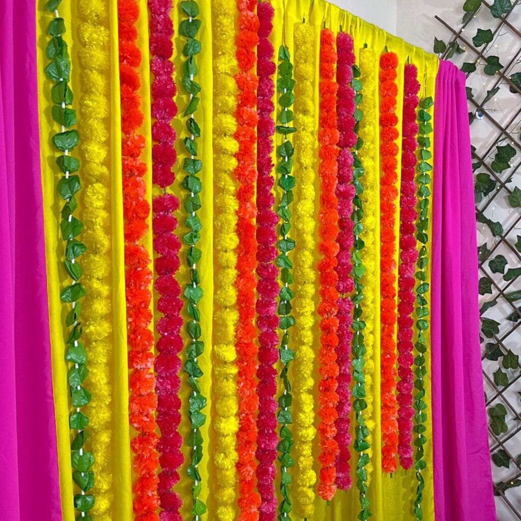 Marigold Haldi Backdrop Decoration - Band Baja Weddings